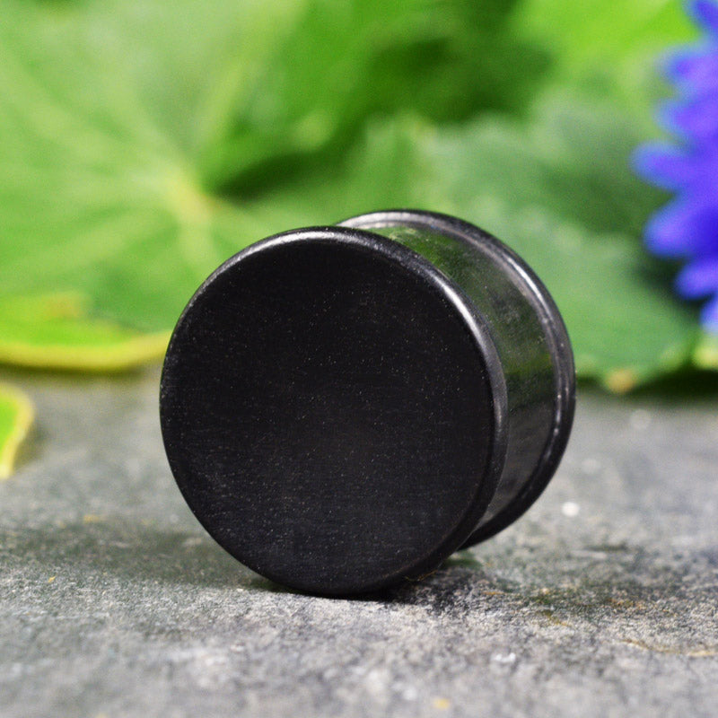 Black Wood Flesh Plugs. Plugs made from Black Arang Wood. – Arka